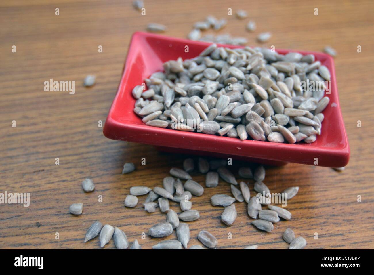 Sunflower seed in red pot Stock Photo - Alamy