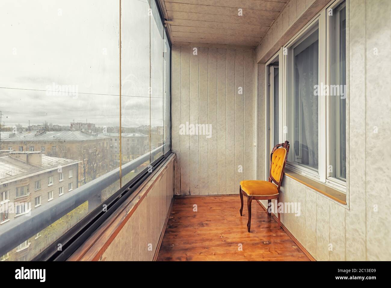Small old common open balcony interior in high residential apartment ...