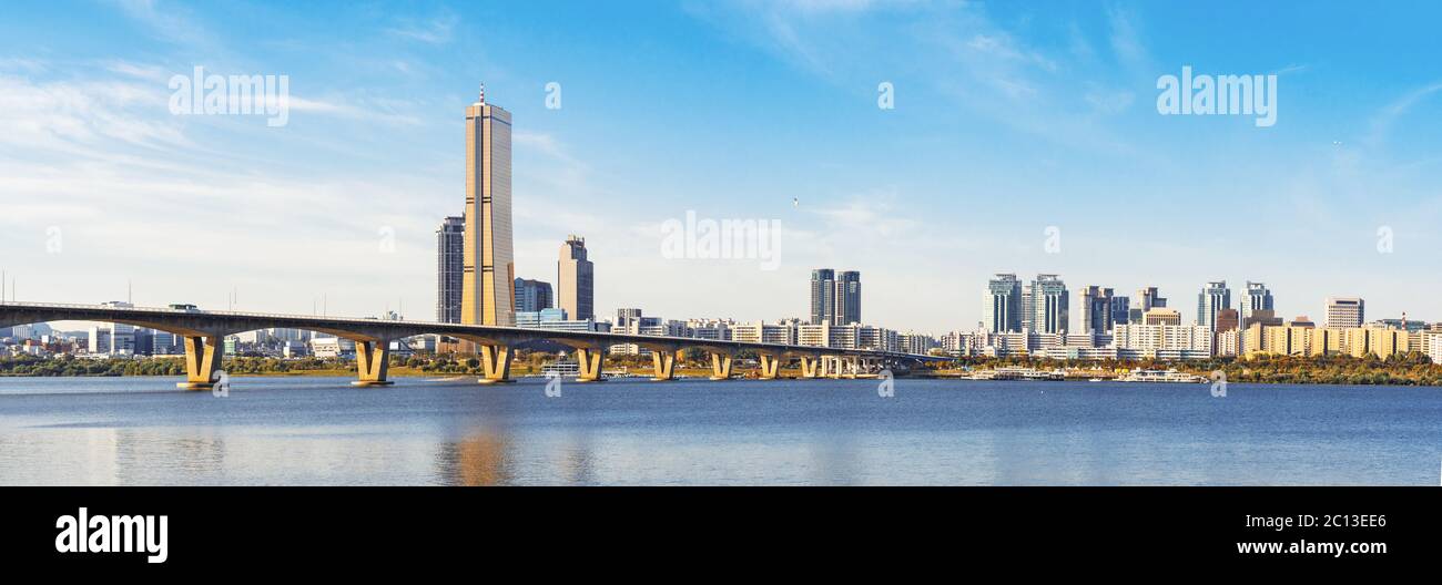modern office buildings near bridge from river Stock Photo - Alamy