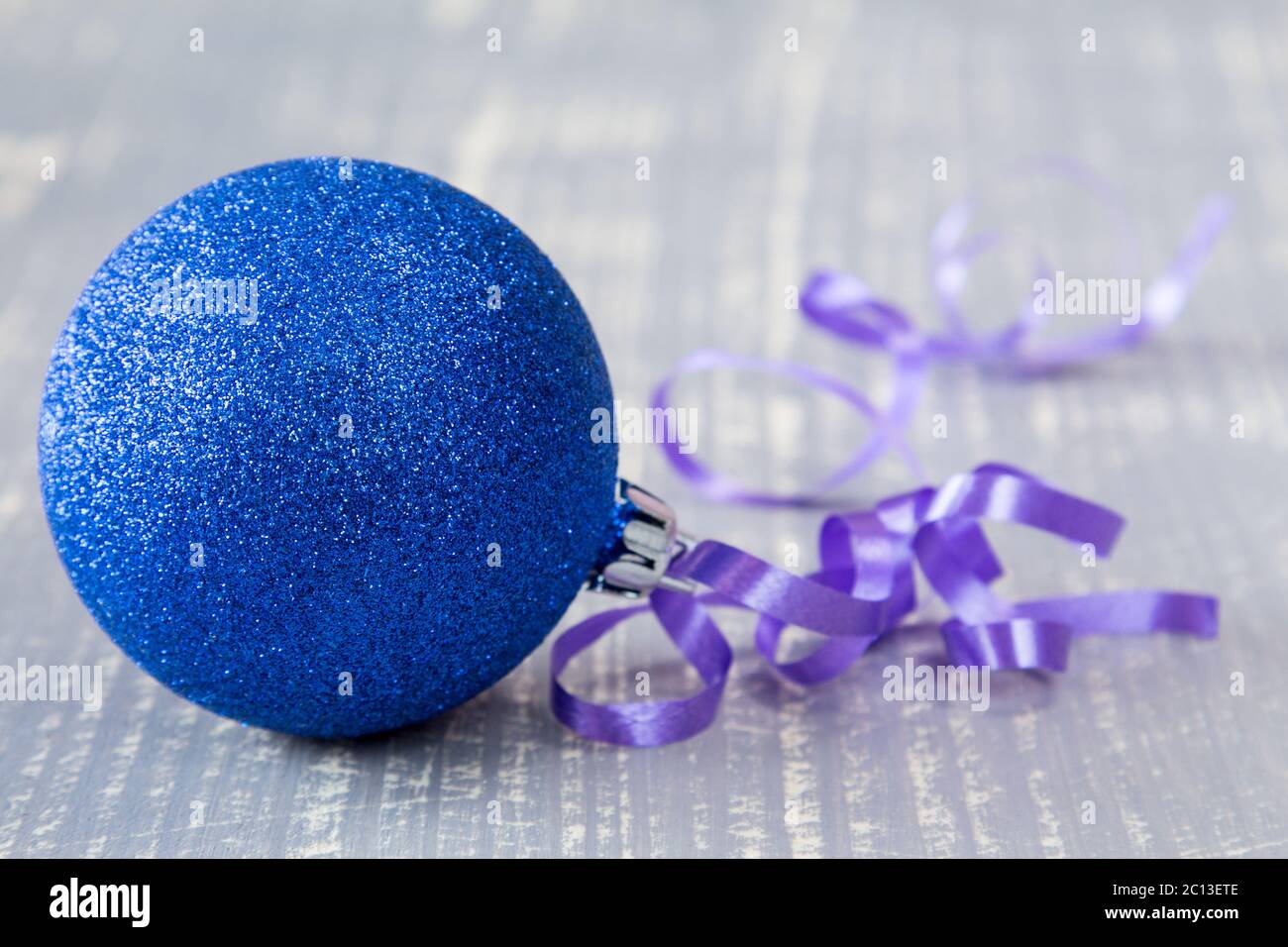 Blue bauble with ribbon Stock Photo - Alamy