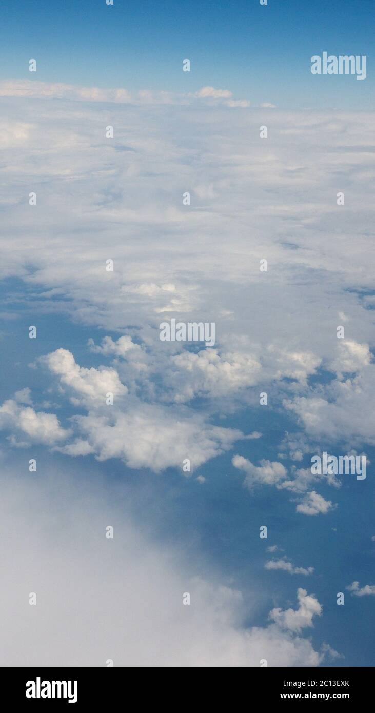 Blue sky with clouds background - vertical Stock Photo - Alamy