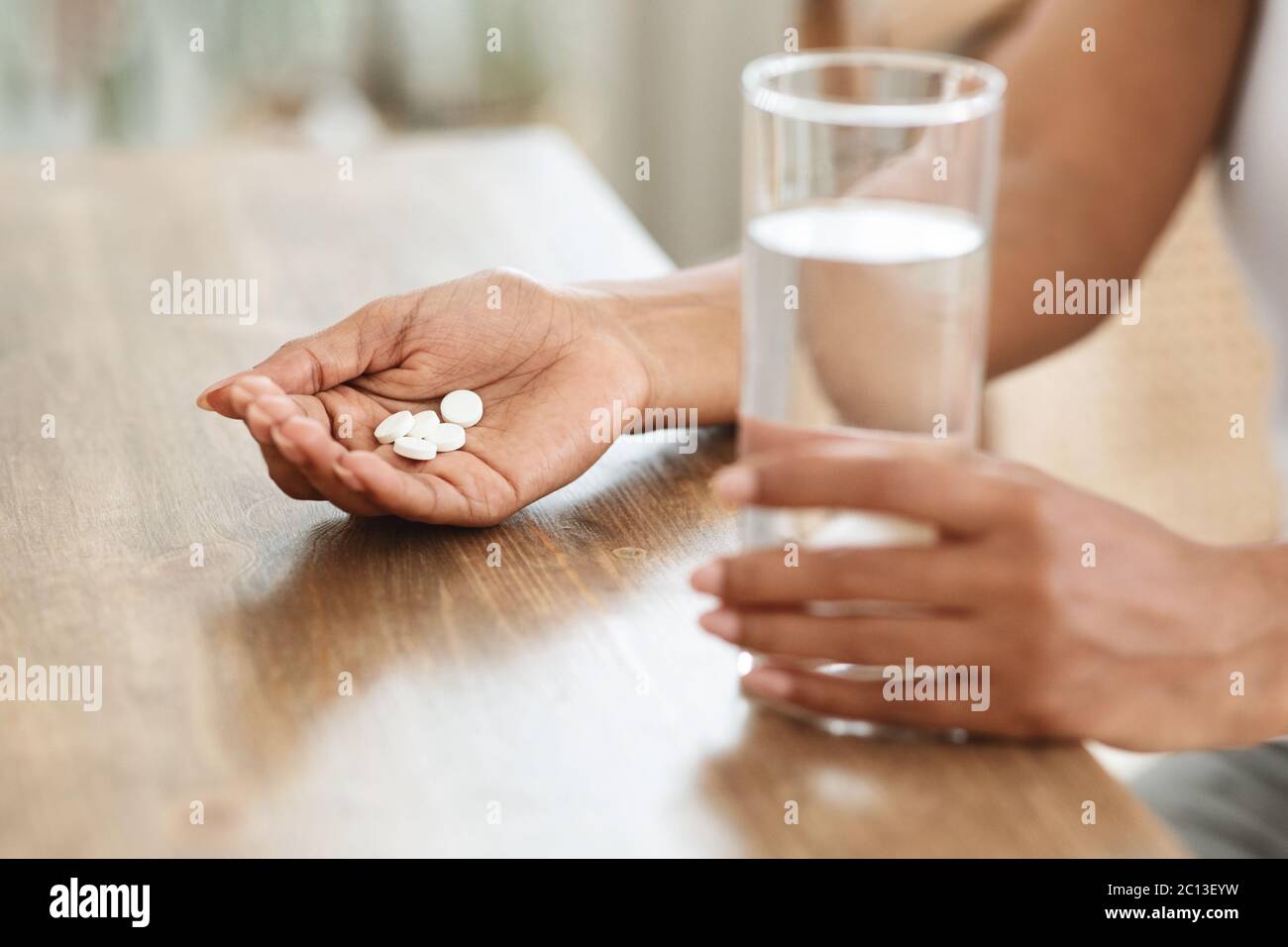Dietary Supplements. Unrecognizable Black Woman Taking Pills And ...