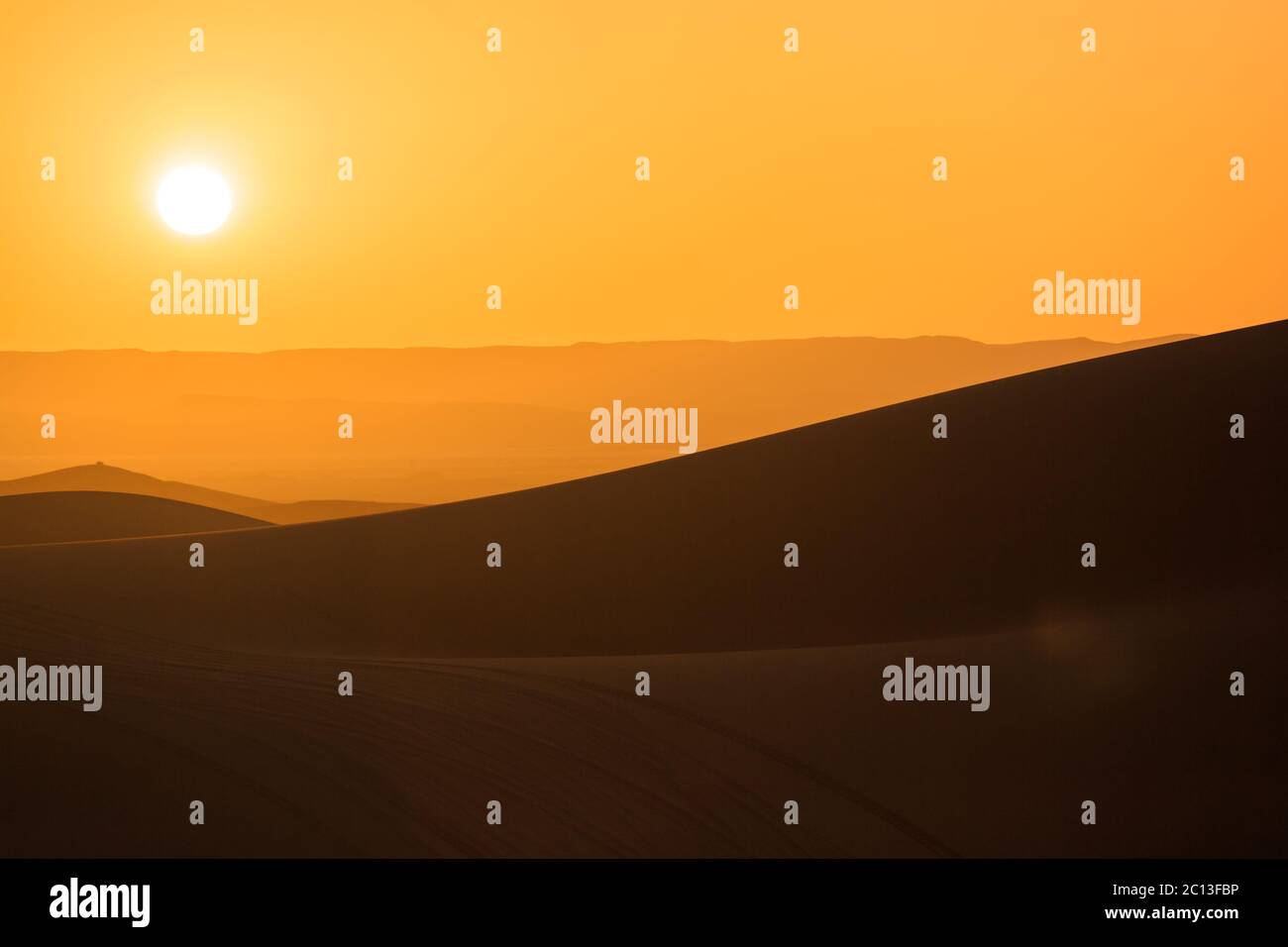 Beautiful sunset over the sand dunes in the Sahara desert, Morocco ...