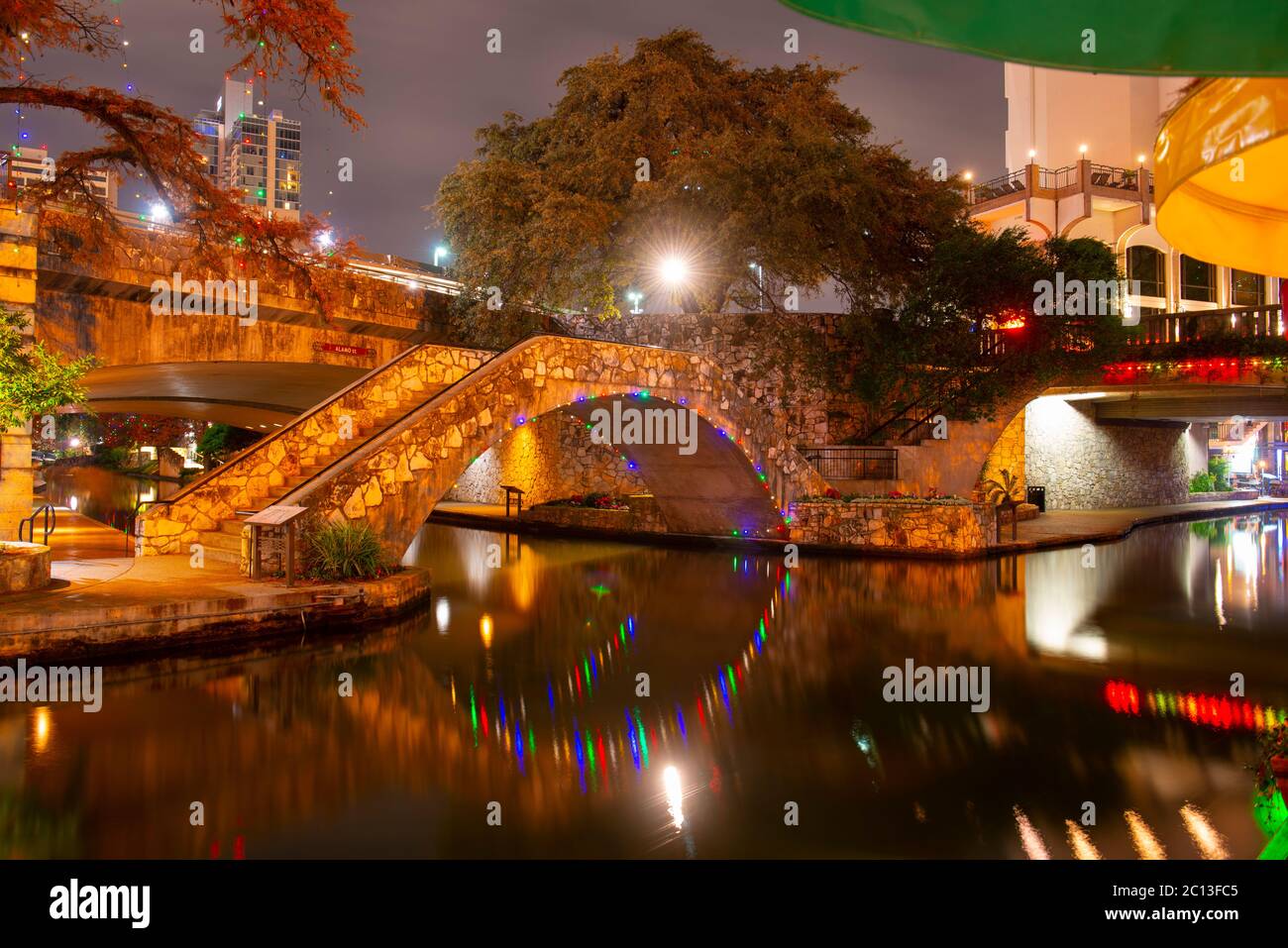 San Antonio River Walk and stone bridge over San Antonio River near ...