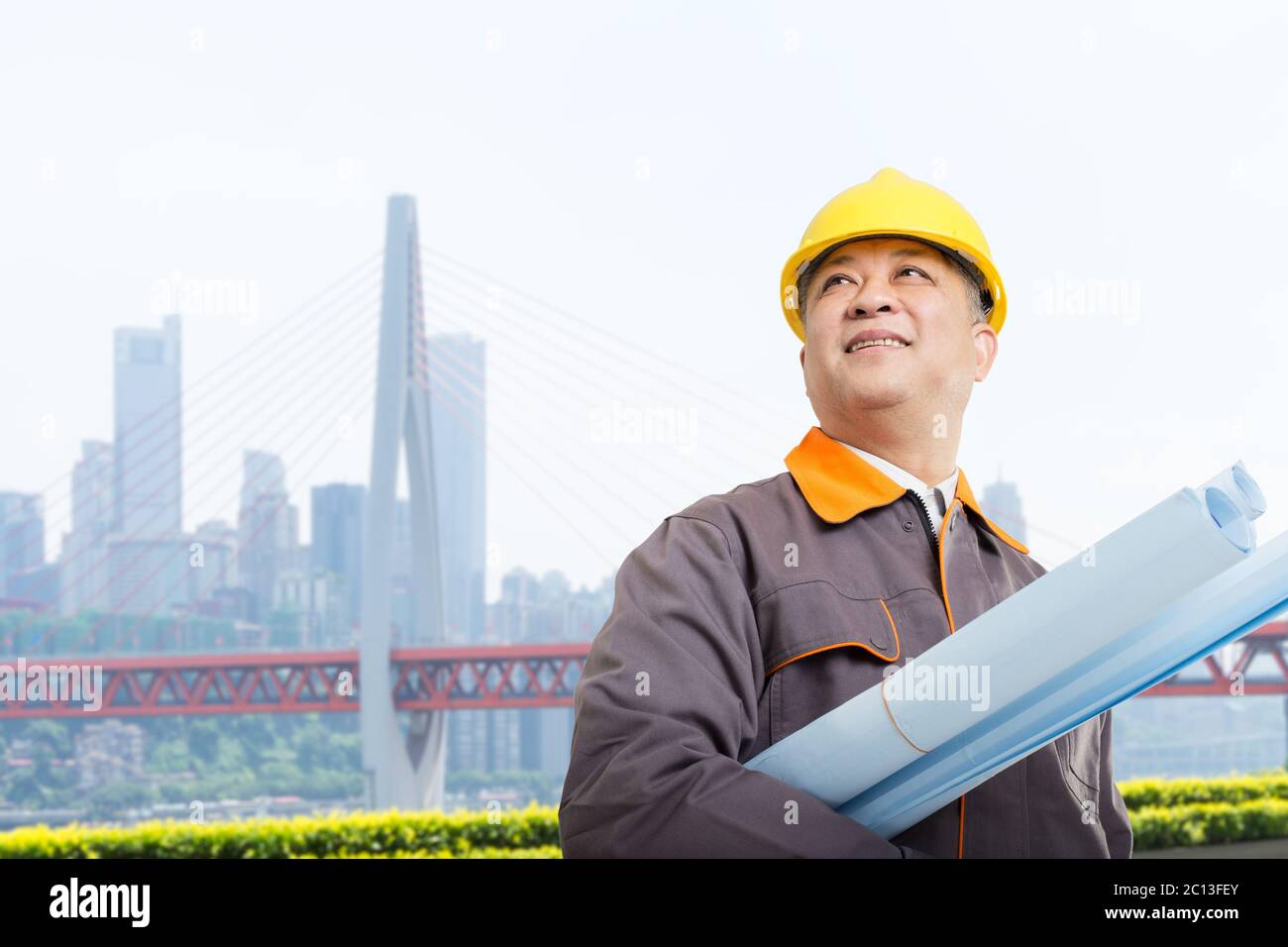 old asian man engineer with blueprint and bridge Stock Photo - Alamy