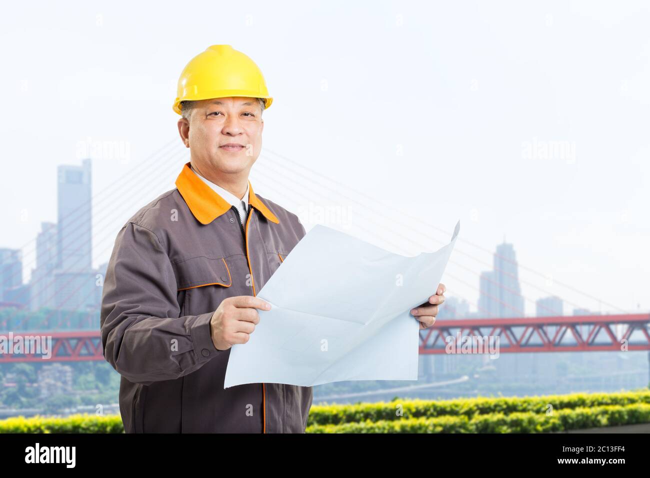 old asian man engineer with blueprint and bridge Stock Photo - Alamy