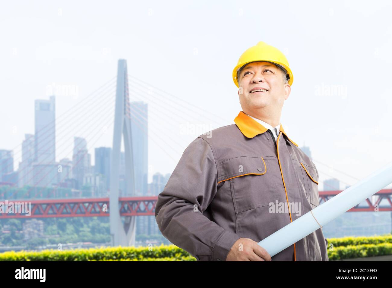 old asian man engineer with blueprint and bridge Stock Photo - Alamy