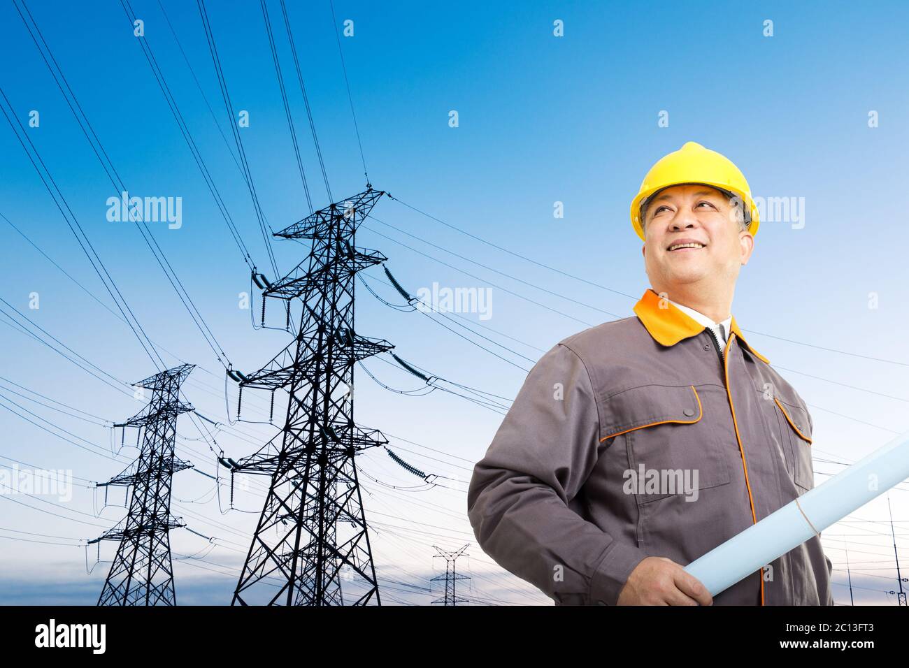 asian man engineer with blueprint and pylon Stock Photo - Alamy
