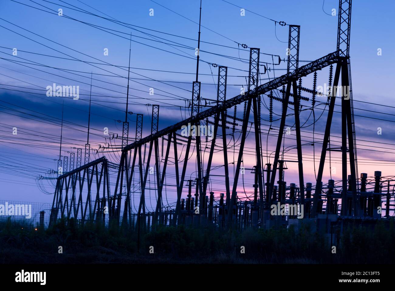 pylons near power station Stock Photo - Alamy