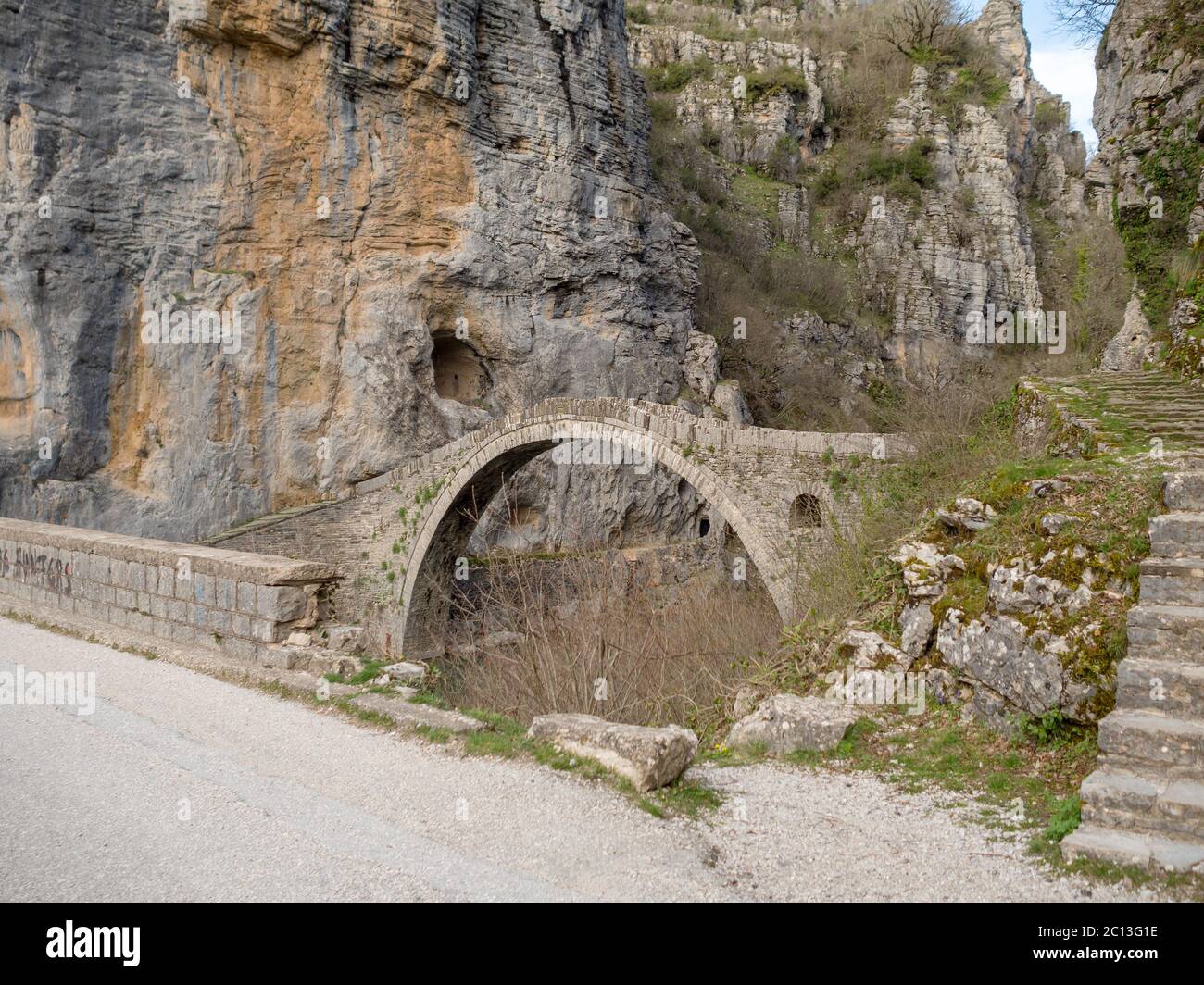 Old stone arched bridge named kokkori on Vikos canyon, Zagorochoria ...