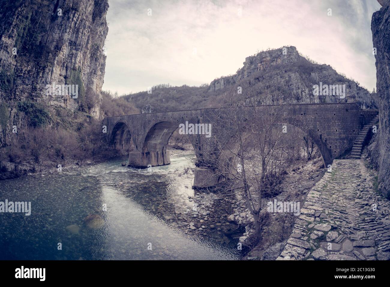 Old stone arched bridge named kokkori on Vikos canyon, Zagorochoria ...