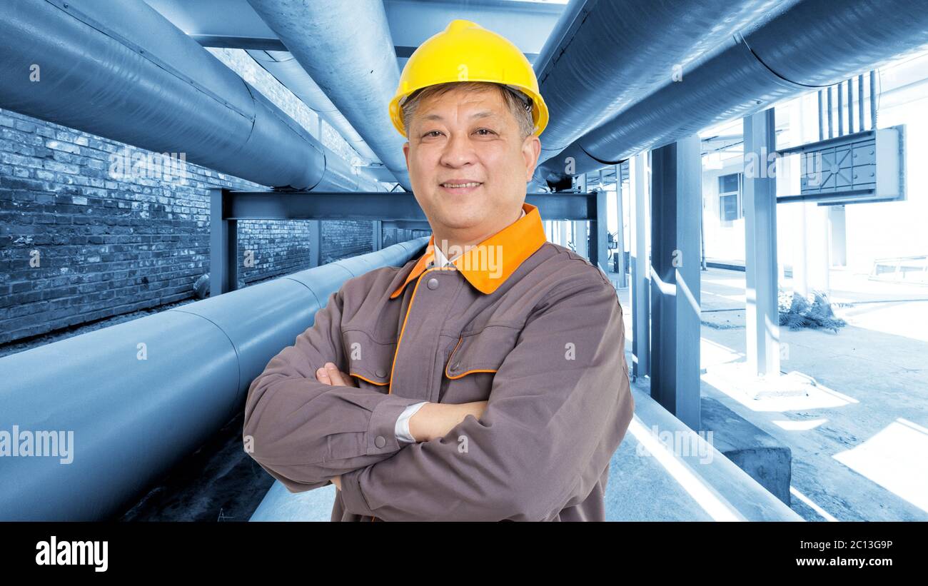 old asian man engineer and pipeline in oil storage Stock Photo - Alamy
