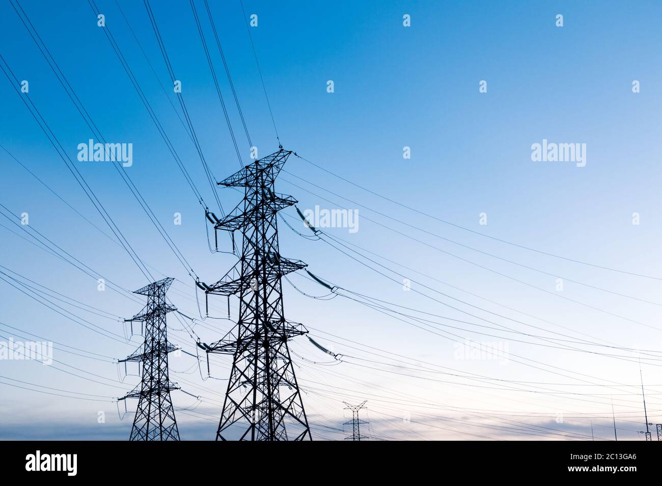 pylons in blue sky Stock Photo - Alamy