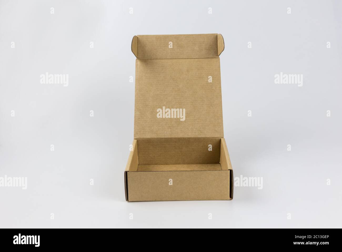 isolated yellow paper box on white background Stock Photo - Alamy