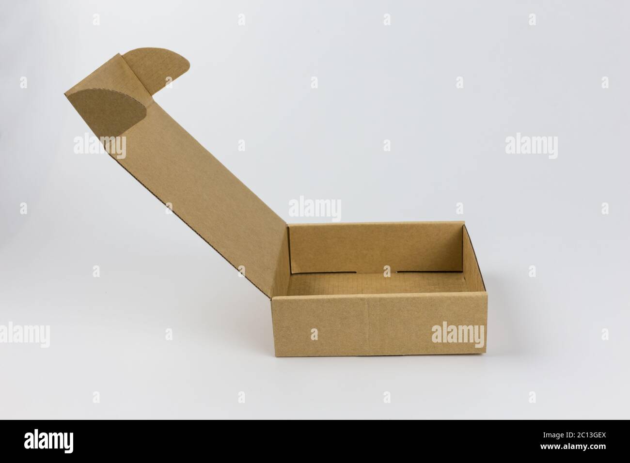 isolated yellow paper box on white background Stock Photo - Alamy
