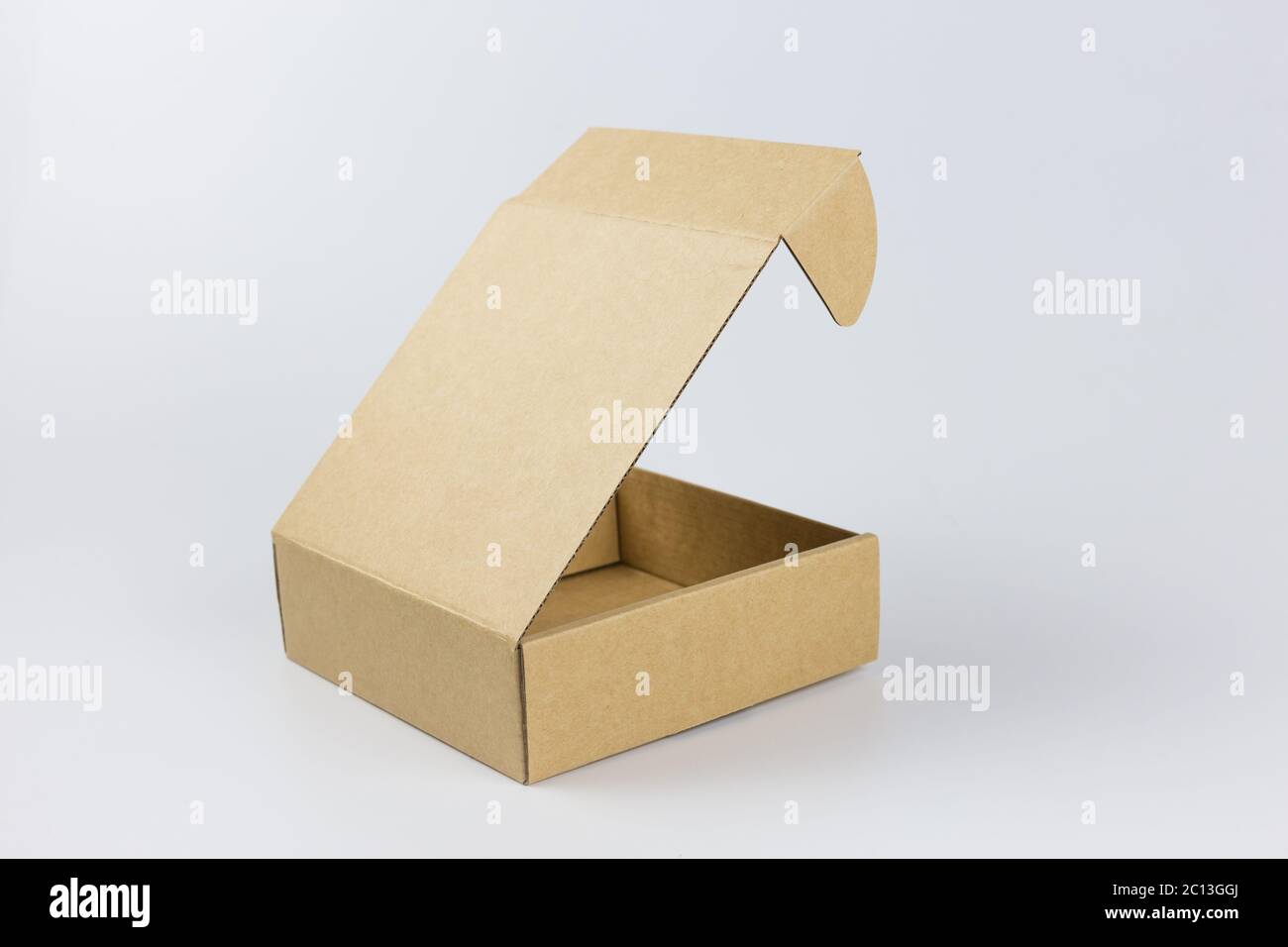 isolated yellow paper box on white background Stock Photo - Alamy