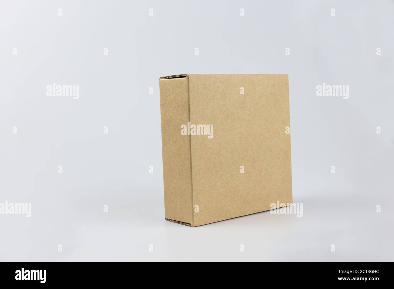 isolated yellow paper box on white background Stock Photo - Alamy