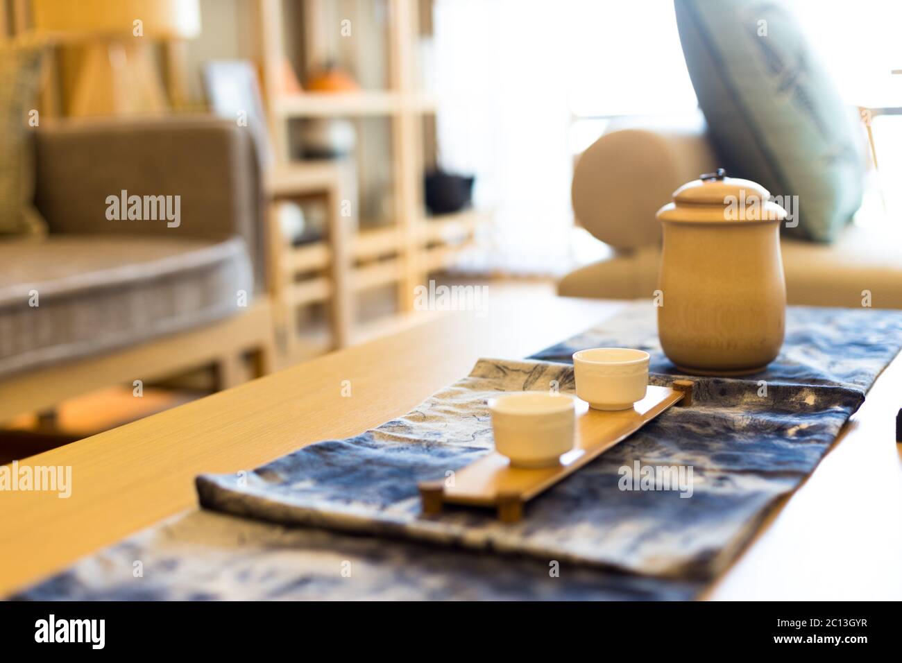 elegant ceramic tea sets on table in modern living room Stock Photo - Alamy