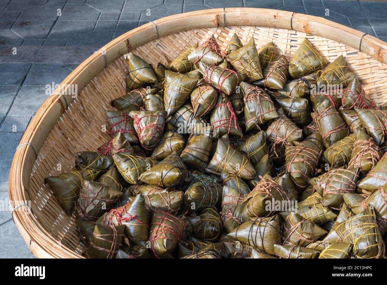 Rice dumpling wrapped in bamboo leaves hi-res stock photography and ...