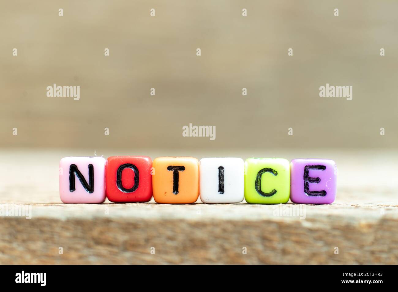 Colorful bead with black letter in word notice on wood background Stock ...