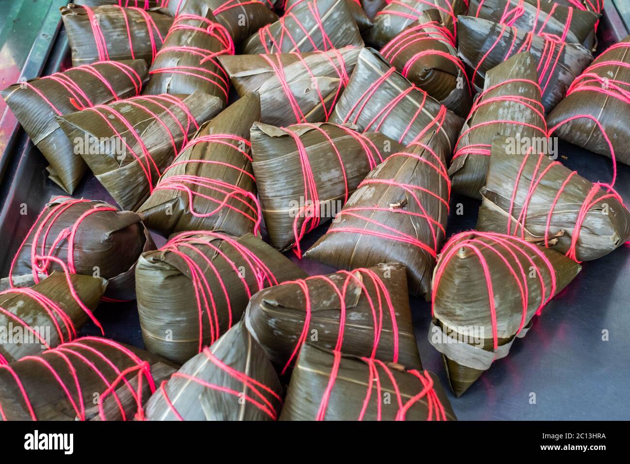 Rice dumpling wrapped in bamboo leaves hi-res stock photography and ...