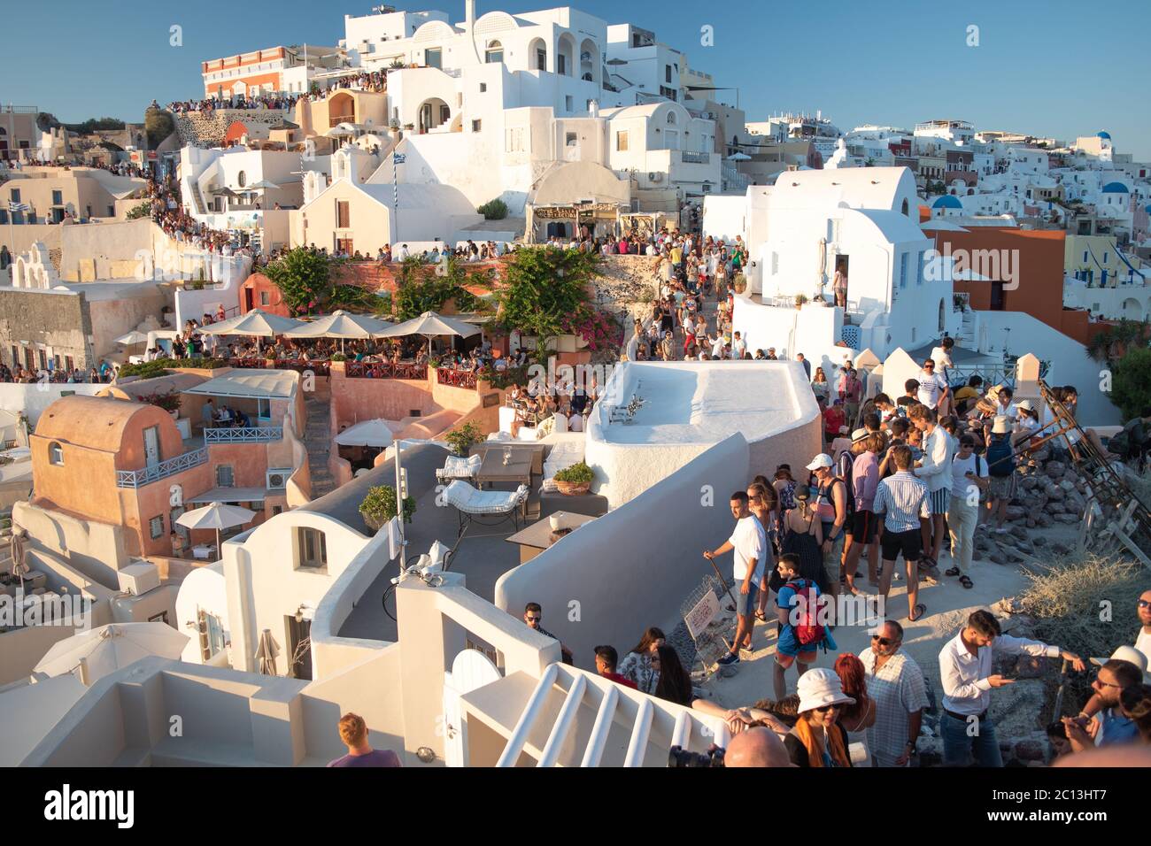 SANTORINI, GREECE - JULY 18 2019: Beautiful village of Oia crowded full ...