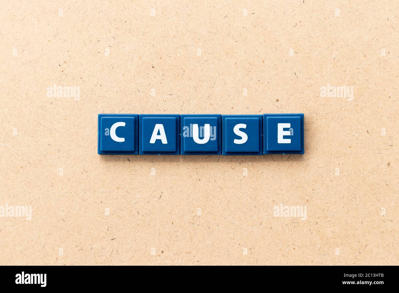 Tile letter in word cause on wood background Stock Photo - Alamy
