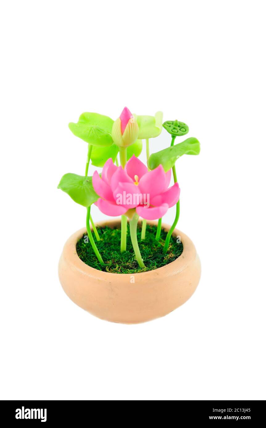 Miniature Plastic Flowers in a Pot Isolated on White Stock Photo - Alamy