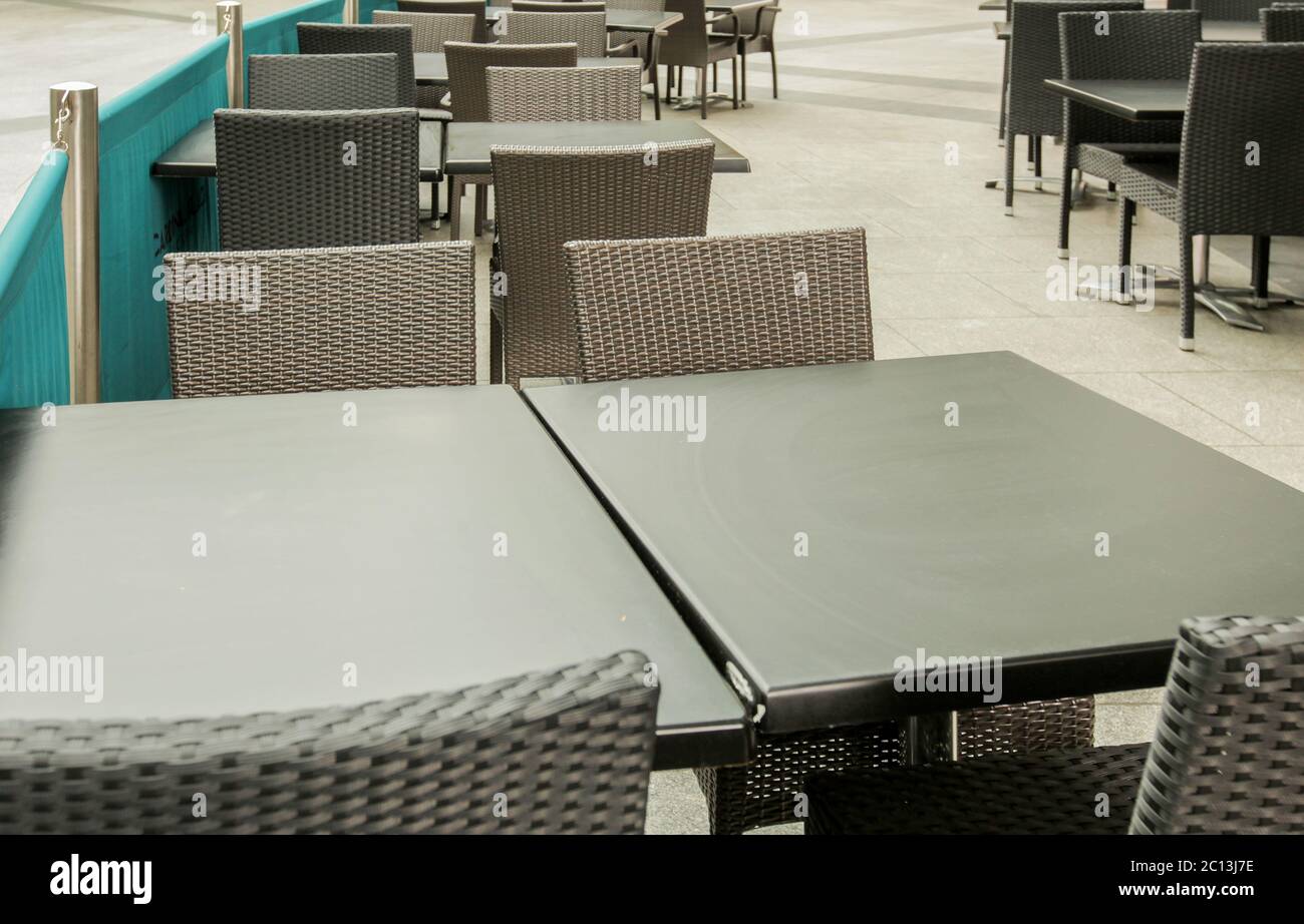 Empty table outside restaurant Stock Photo - Alamy