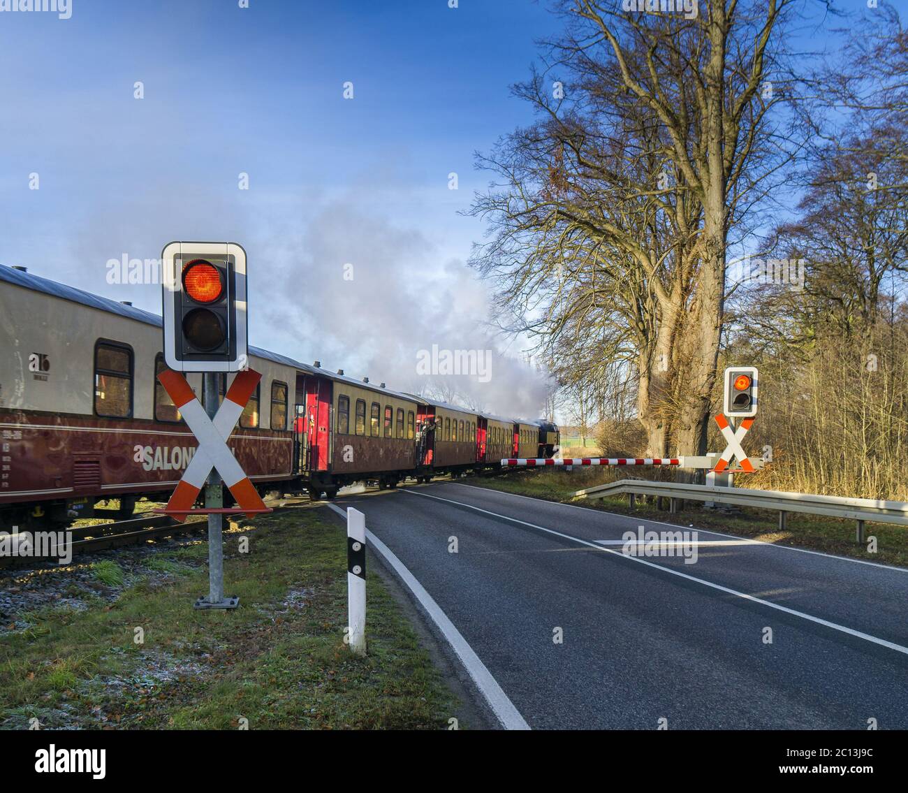 Railway at the level crossing Stock Photo - Alamy