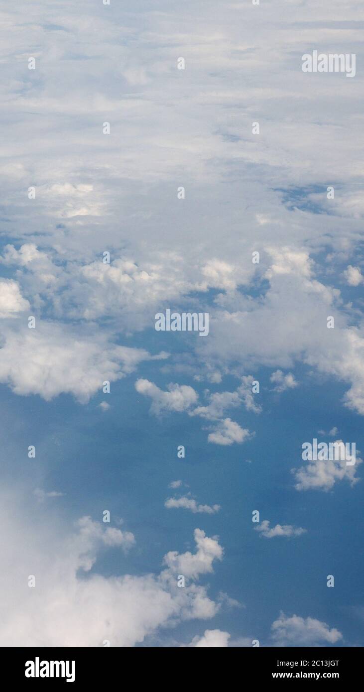 Blue sky with clouds background - vertical Stock Photo - Alamy