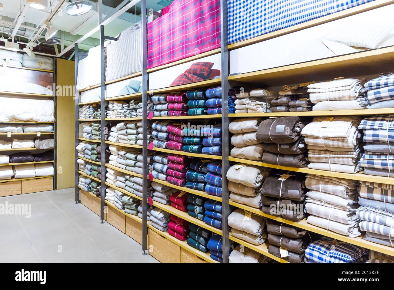 shelf with colorful clothes Stock Photo - Alamy