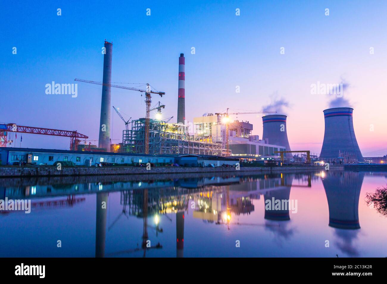 modern waterfront power plant at sunset Stock Photo - Alamy