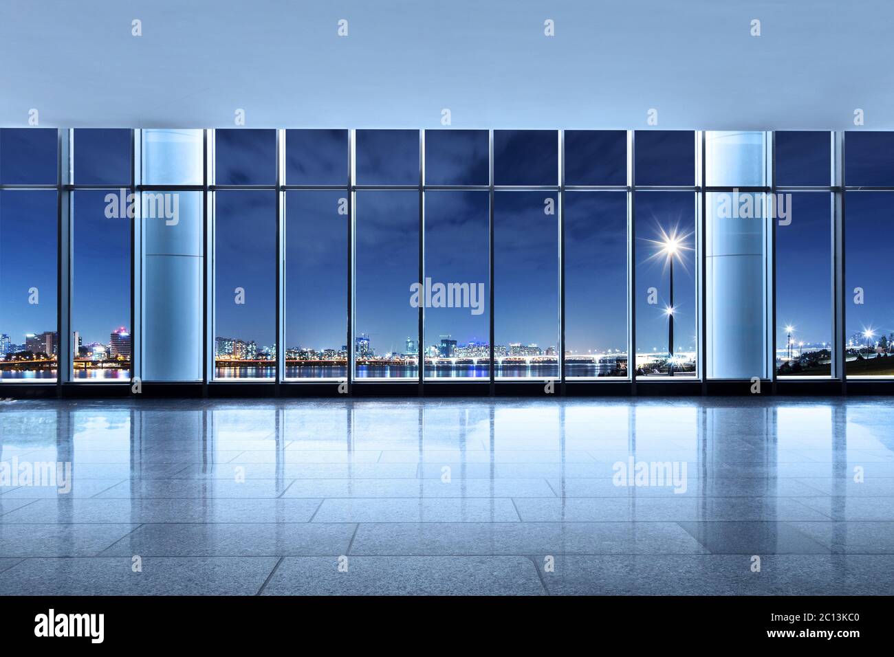 cityscape and skyline of modern city from window at night Stock Photo ...