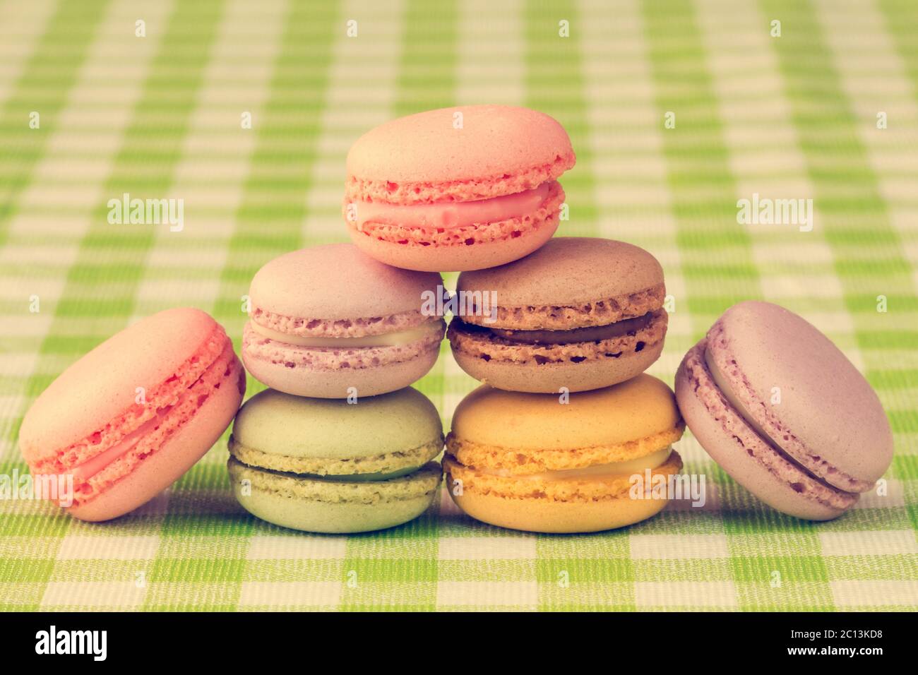 Macaroons stacked on checkered tablecloth Stock Photo - Alamy