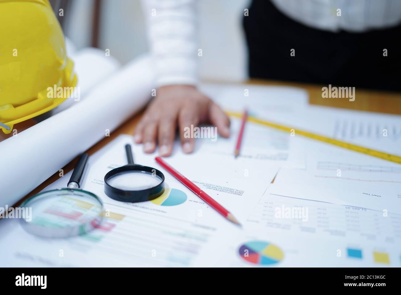 Architect or engineer working project accounting with graph with tools ...