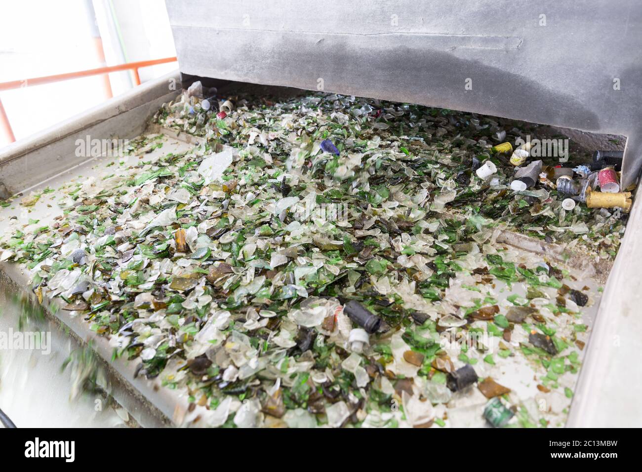 Glass waste in recycling facility. Glass particles in a machine Stock ...