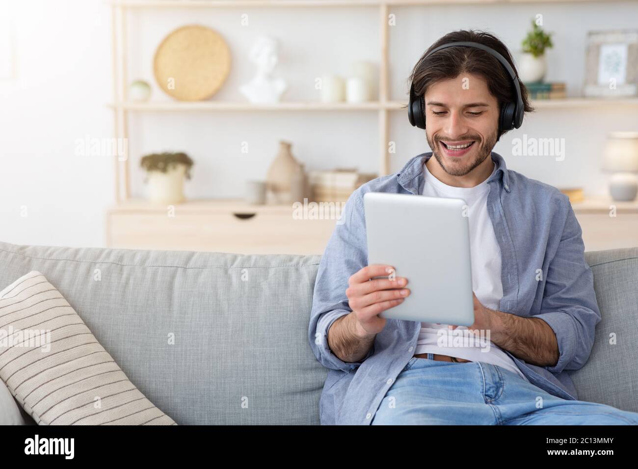 Watching videos on modern hi-res stock photography and images - Alamy