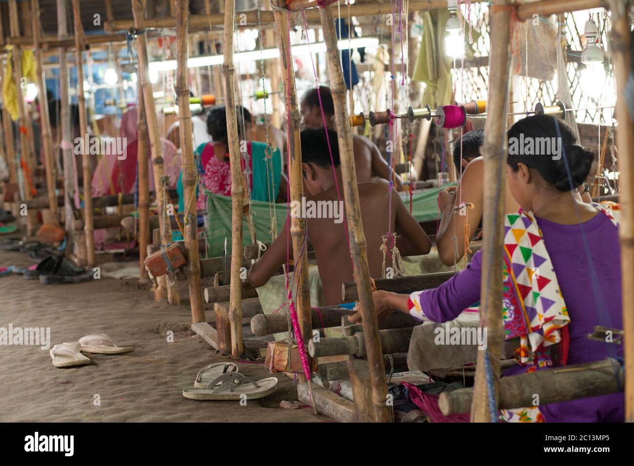 DHAKA, BANGLADESH 07th July : A Bangladeshi weaver designs a Jamdani Sari (women’s wear) in the ...