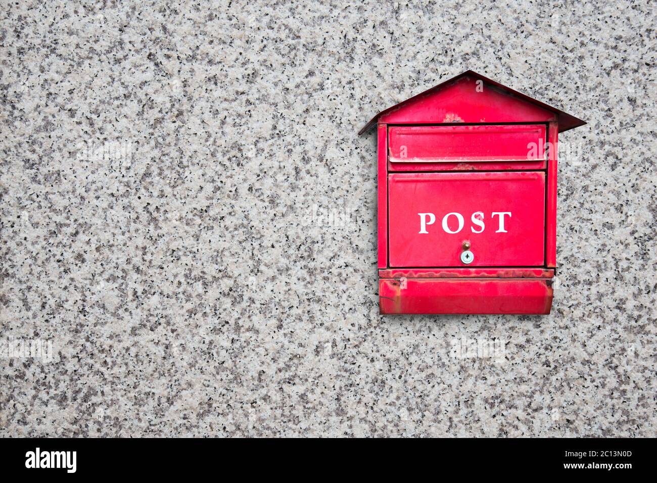 Red post box on wall Stock Photo - Alamy
