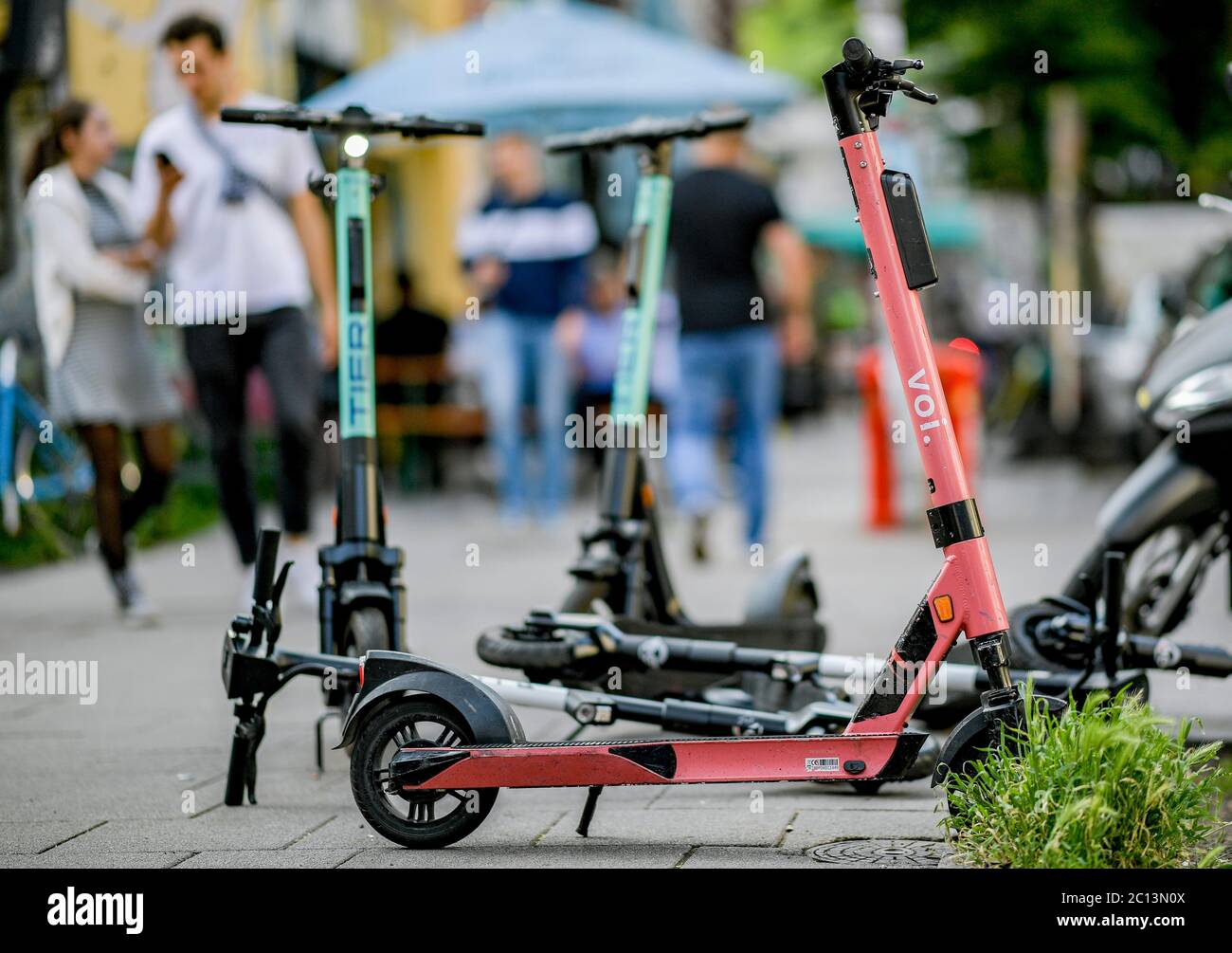 Hamburg, Germany. 12th June, 2020. E-scooters are parked on a sidewalk ...