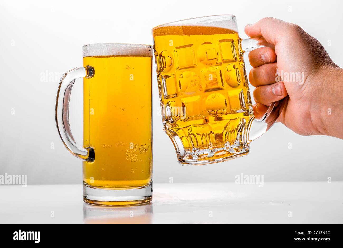 Close up two glass mugs hi-res stock photography and images - Alamy