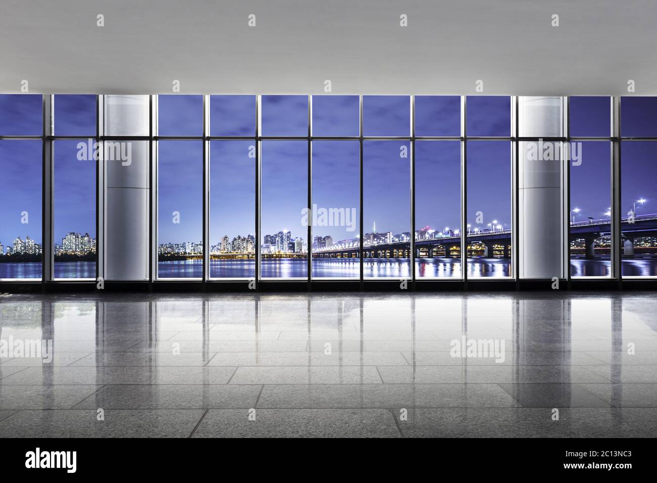 Cityscape and skyline at night from window near river Stock Photo - Alamy