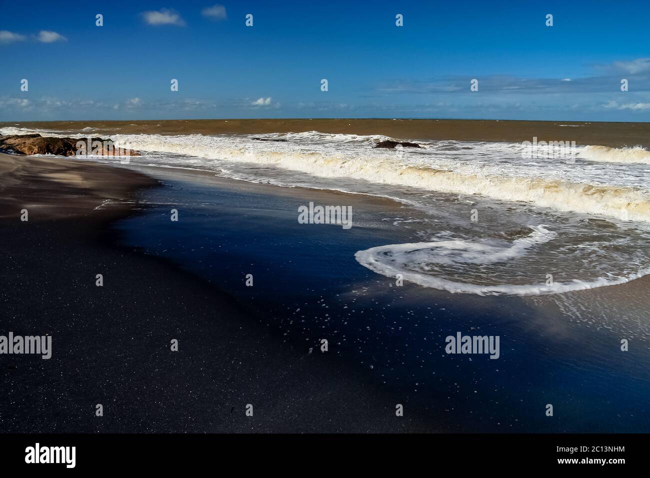 Black sand beach in Madagascar Stock Photo - Alamy