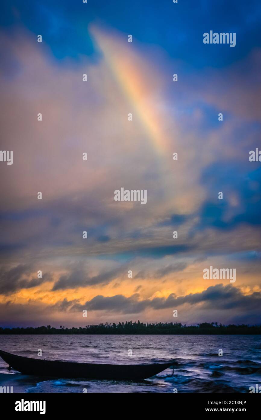 Rainbow over the ocean Stock Photo - Alamy