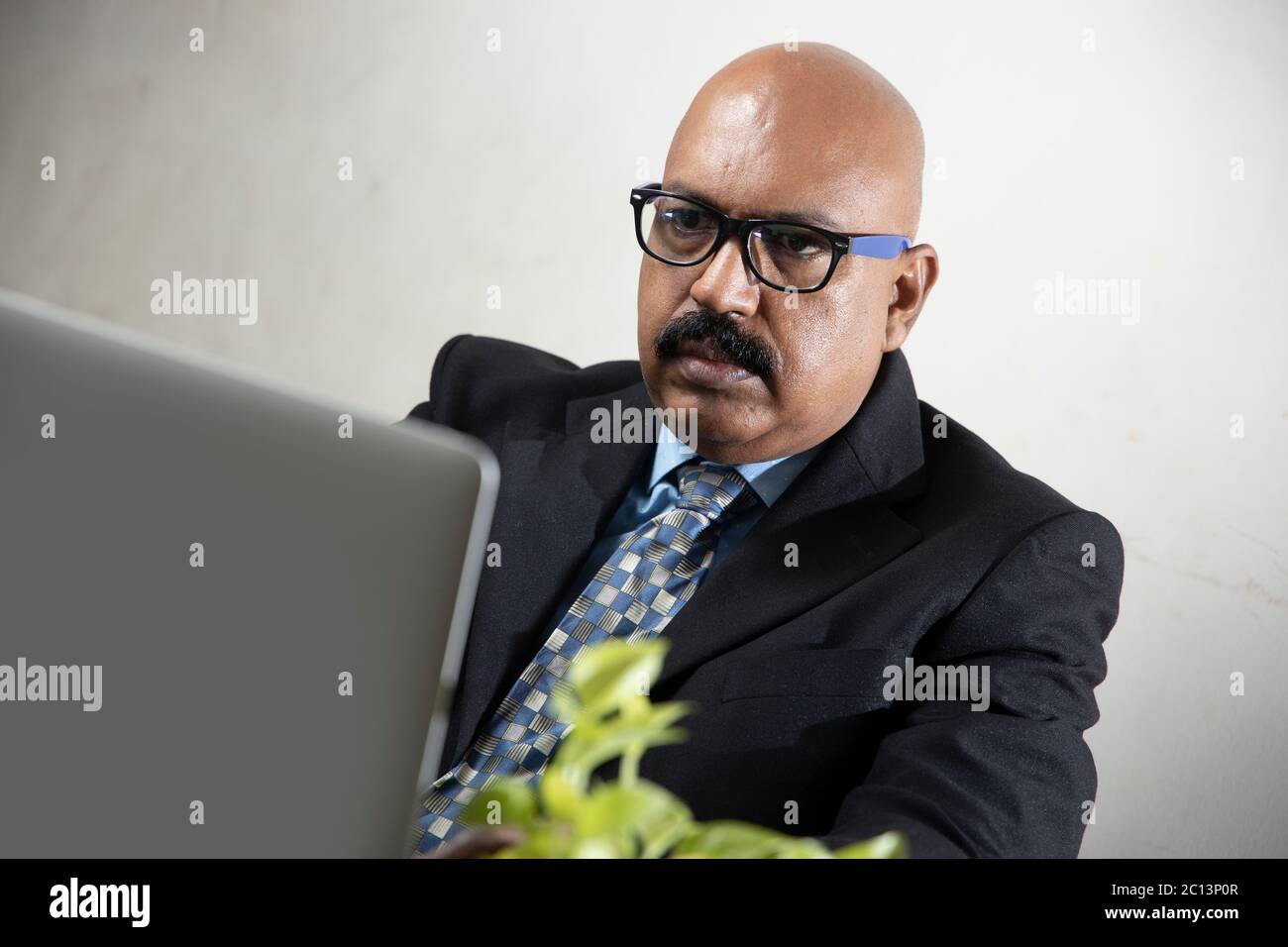 Male manager taking notes in home office. Doing research stock photo ...