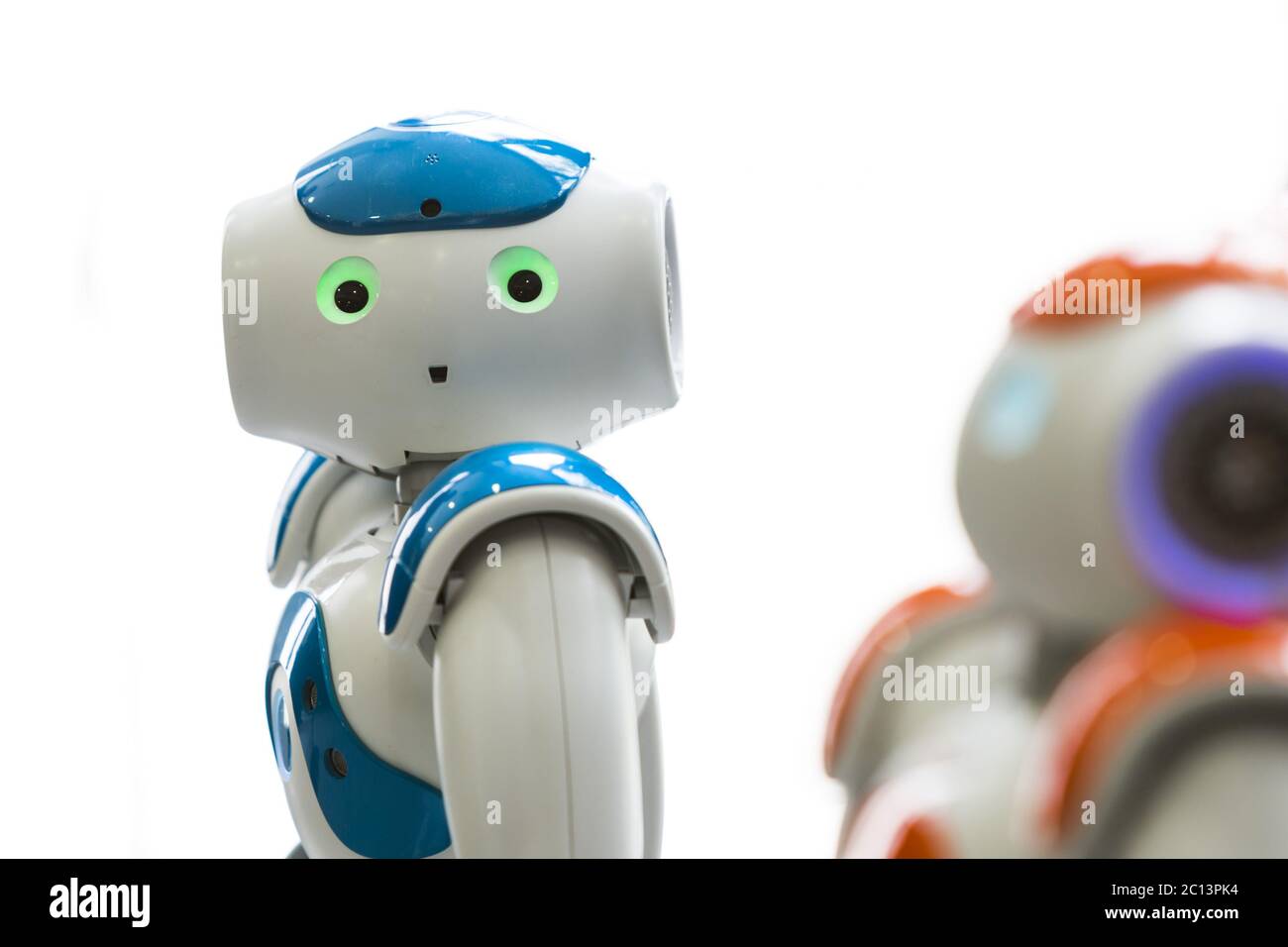 Small robots with human face and body. AI Stock Photo - Alamy