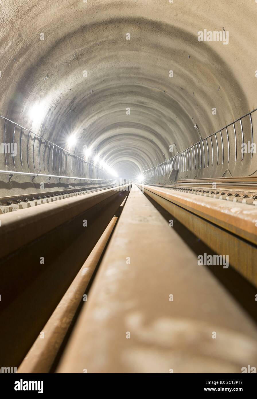 Subway rails during tunnel construction vertical Stock Photo - Alamy