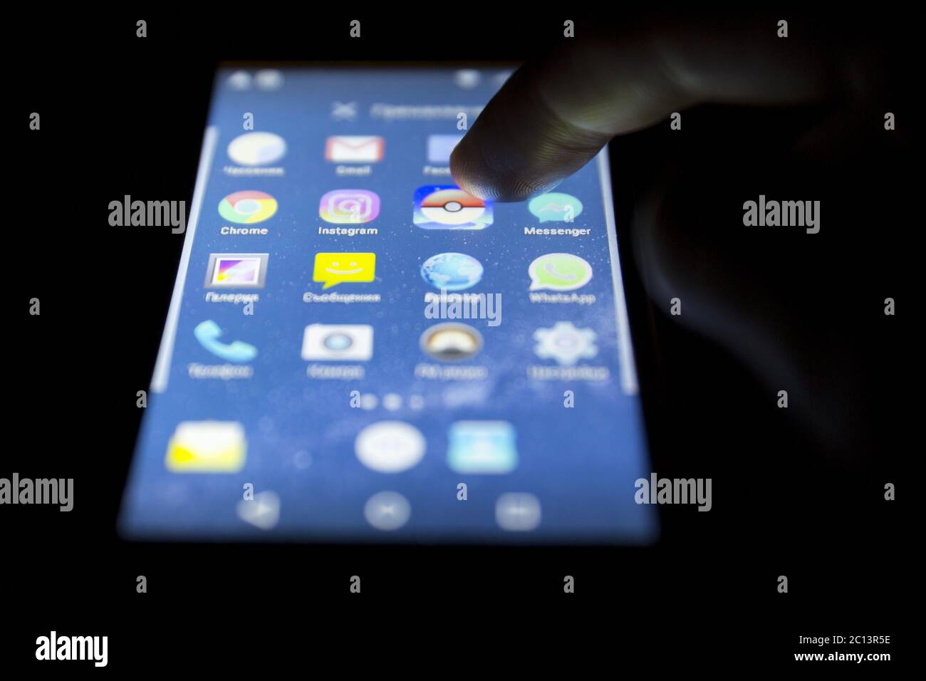 Pokemon Go game human hand Stock Photo - Alamy