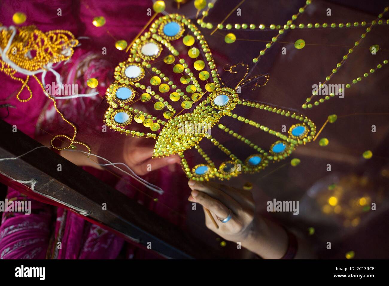 People of Geneva Camp engaged in hand embroidery or 'Karchupi Shilpo ...